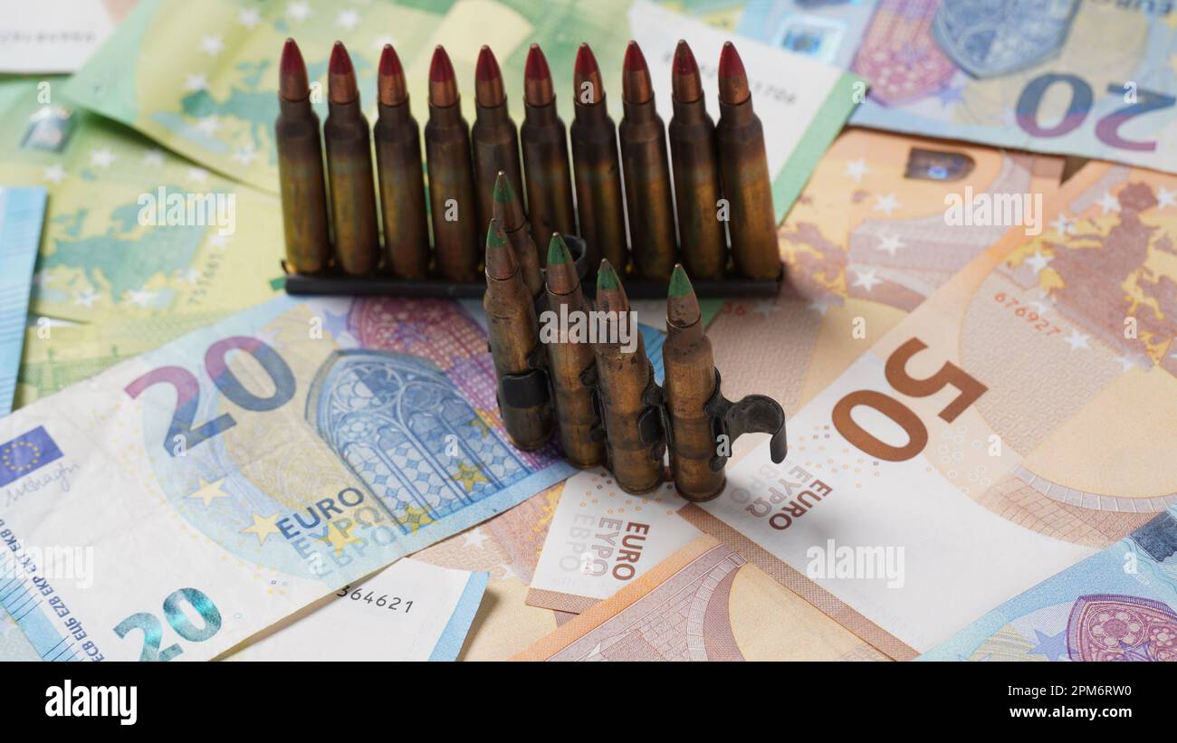 Ammunition from the gun on money bills. Bullets on Euros money ...