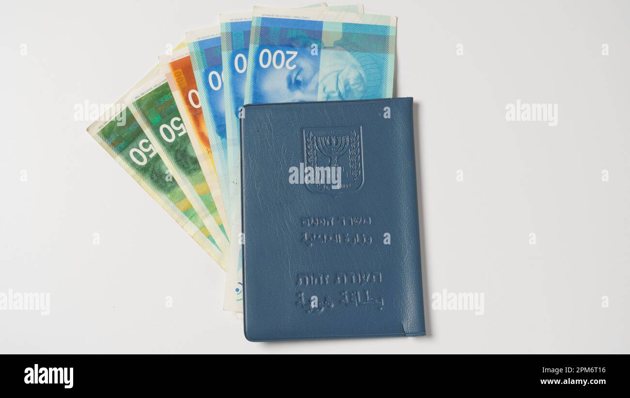 Israeli identity card(Teudat Zehut)with colorful Shekel banknotes ...