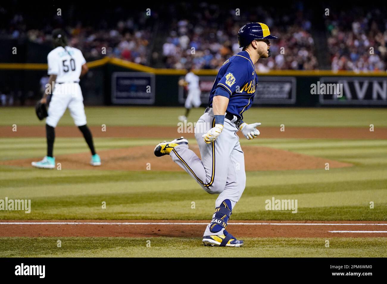 Milwaukee Brewers' Mike Brosseau heads for first on a two-run double ...