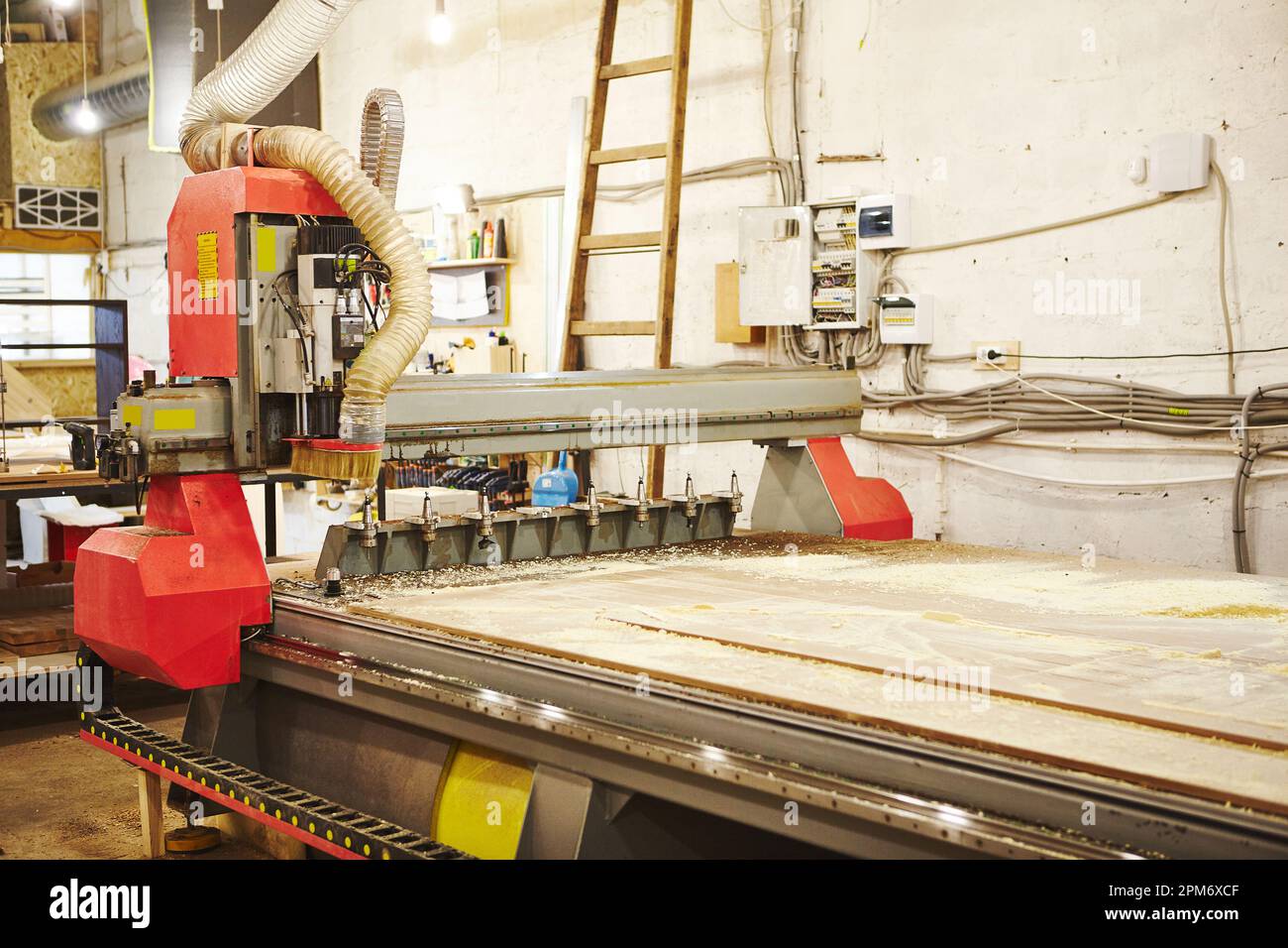 Cnc machine at carpentry workshop. Cutting wood with various router ...