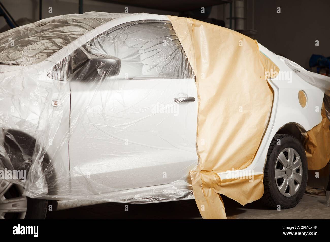 Body repair of the car after the accident. Wraping of vehicle with ...