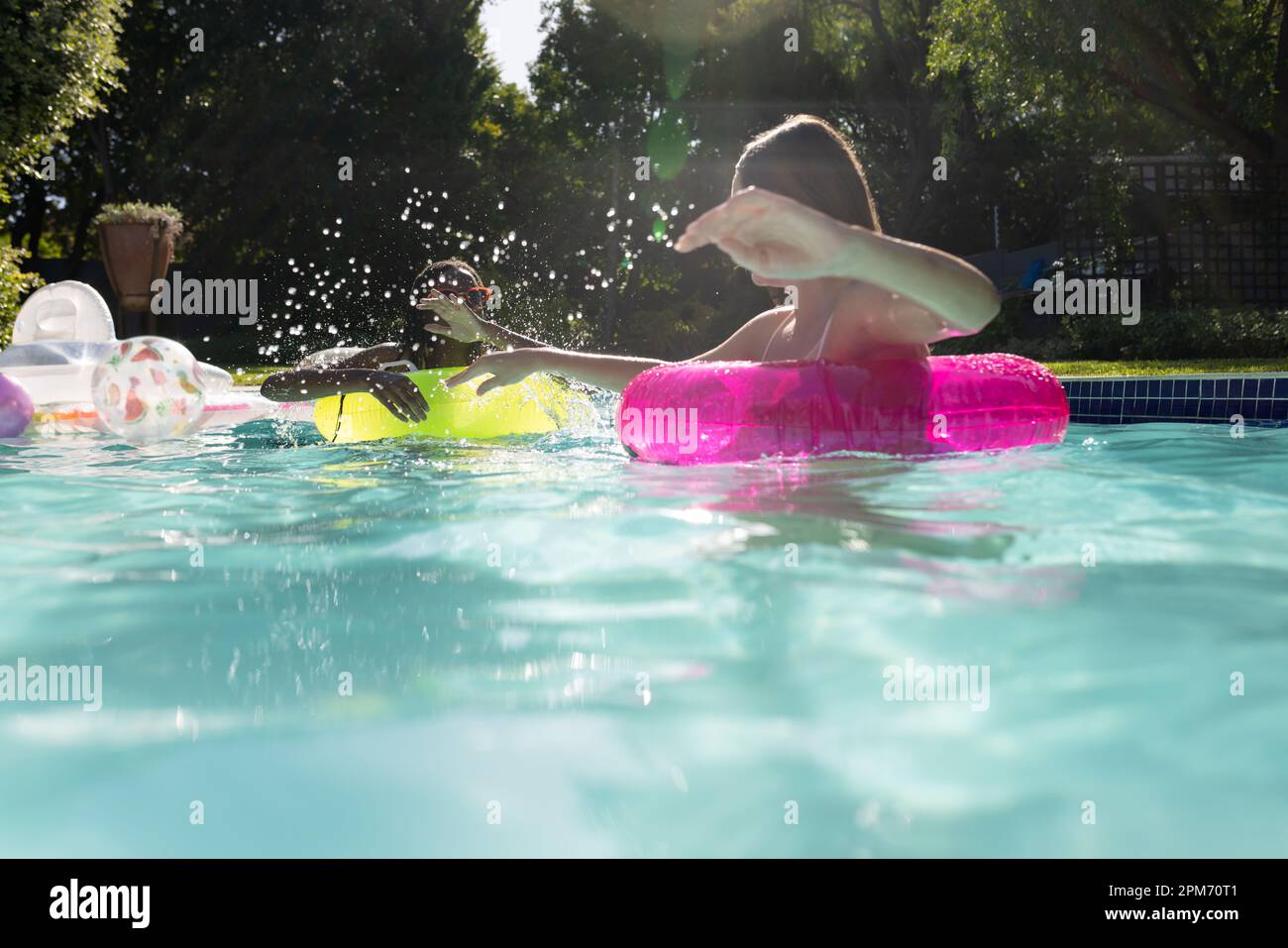 Family playing swimming pool hi-res stock photography and images - Alamy