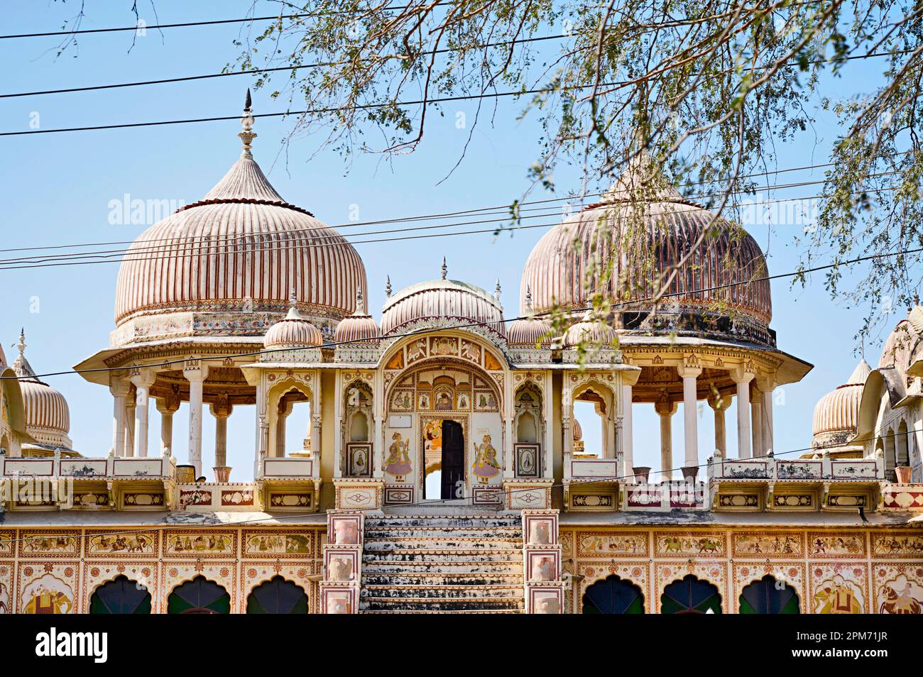 Colourful paintings on the outer wall of an old chhatri, converted in ...
