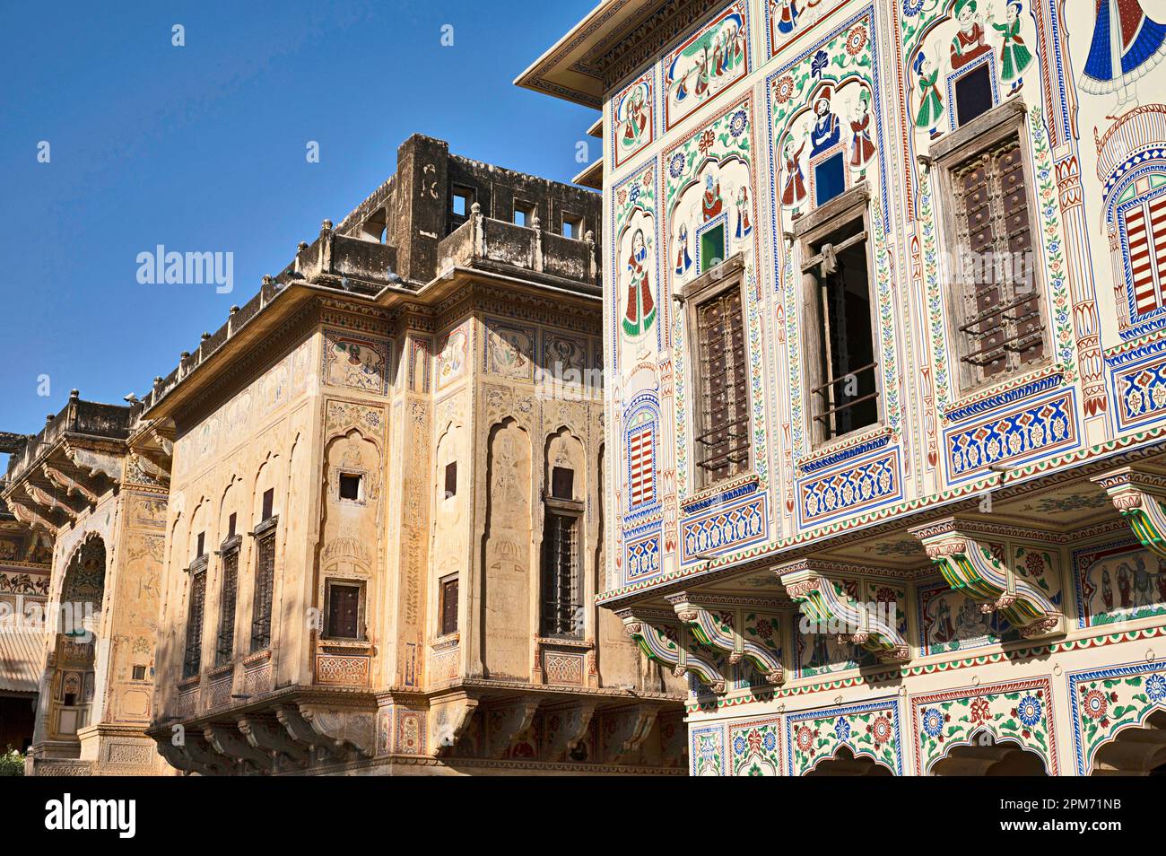 Colourful paintings and wooden windows on the outer wall of Seth ...