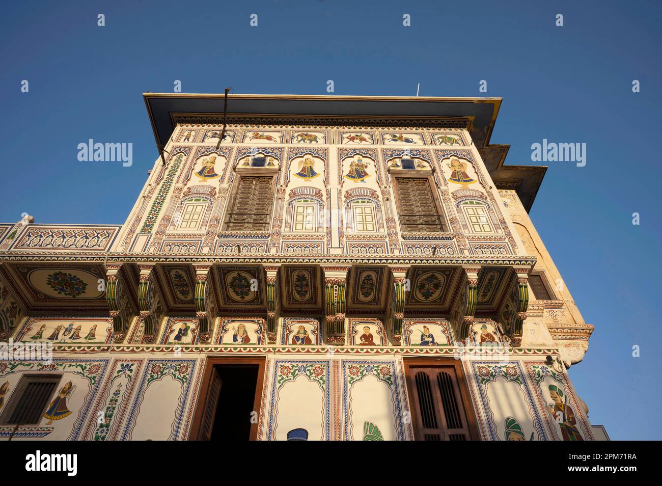 Colourful paintings on the outer wall of an entrance of Seth Harmukhrai ...