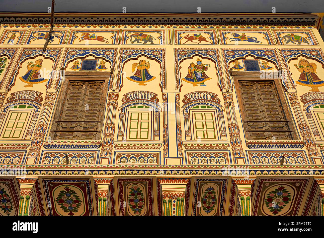 Colourful paintings on the outer wall of an entrance of Seth Harmukhrai ...