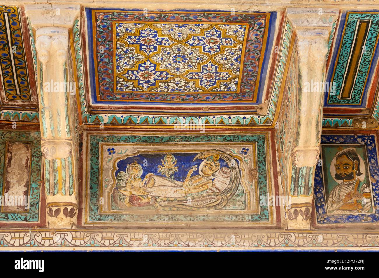 Colourful mythological painting on the ceiling of an old haveli ...