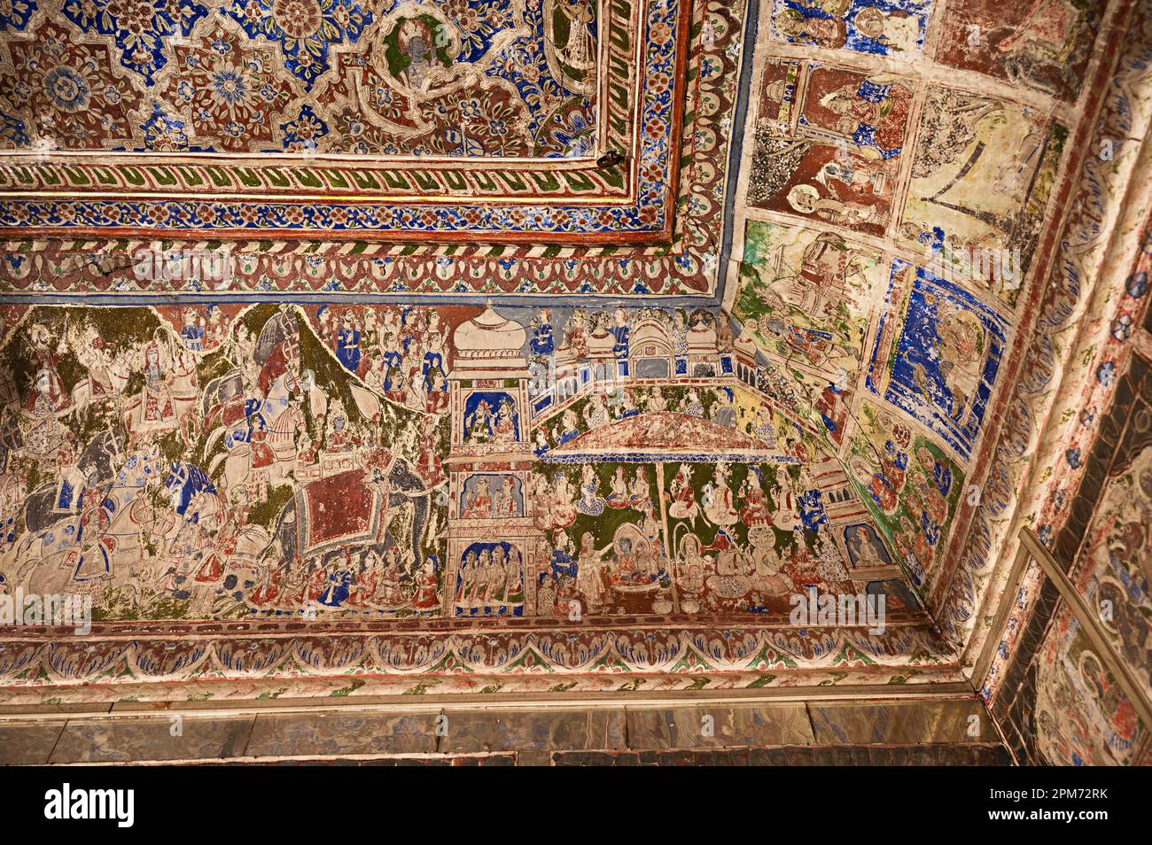 Colourful mythological paintings and mirror work on the ceiling of a ...
