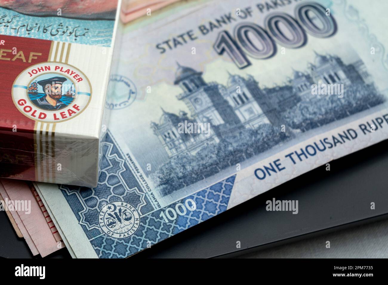 Gold Leaf Cigarette with Pak currency. 1000 rupees Bank notes ...