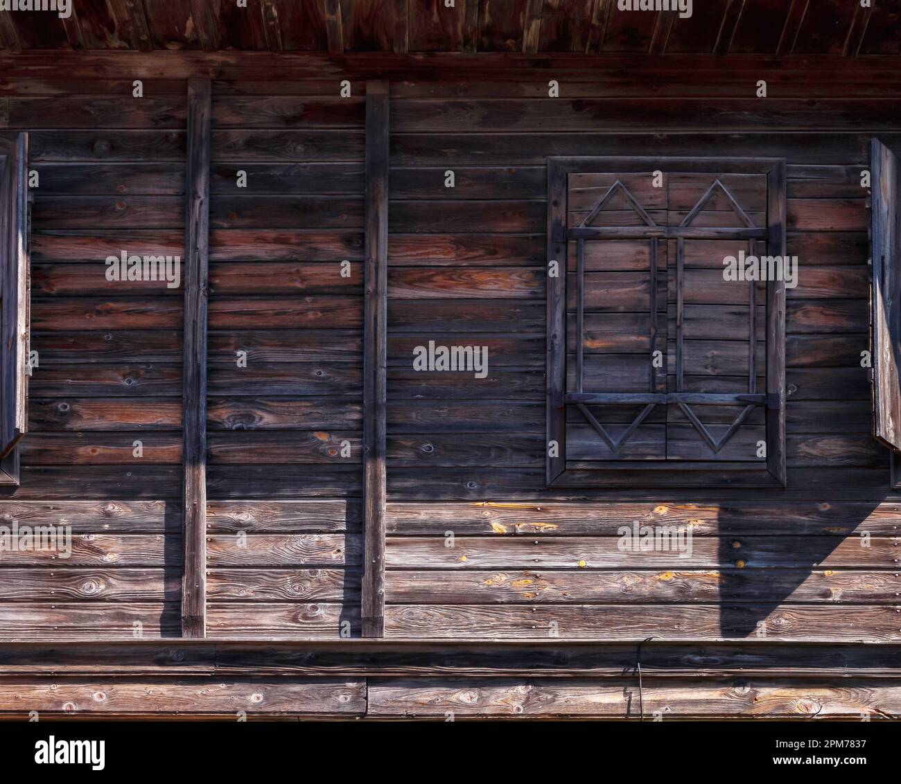 windows on the vintage wooden wall. ancient architecture Stock Photo ...