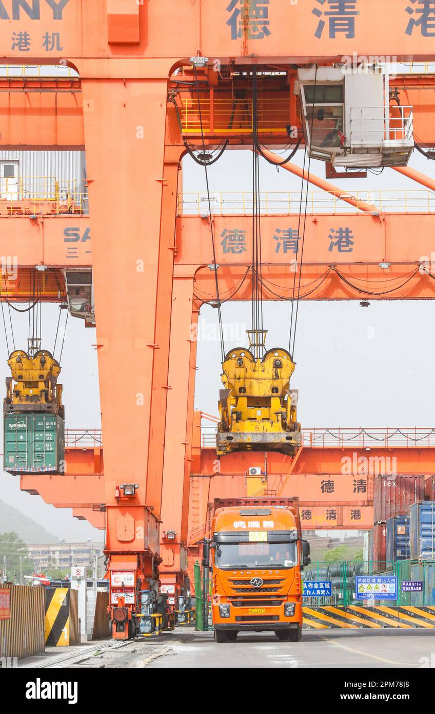 HUZHOU, CHINA - APRIL 12, 2023 - Aerial photo shows cargo ships loading ...