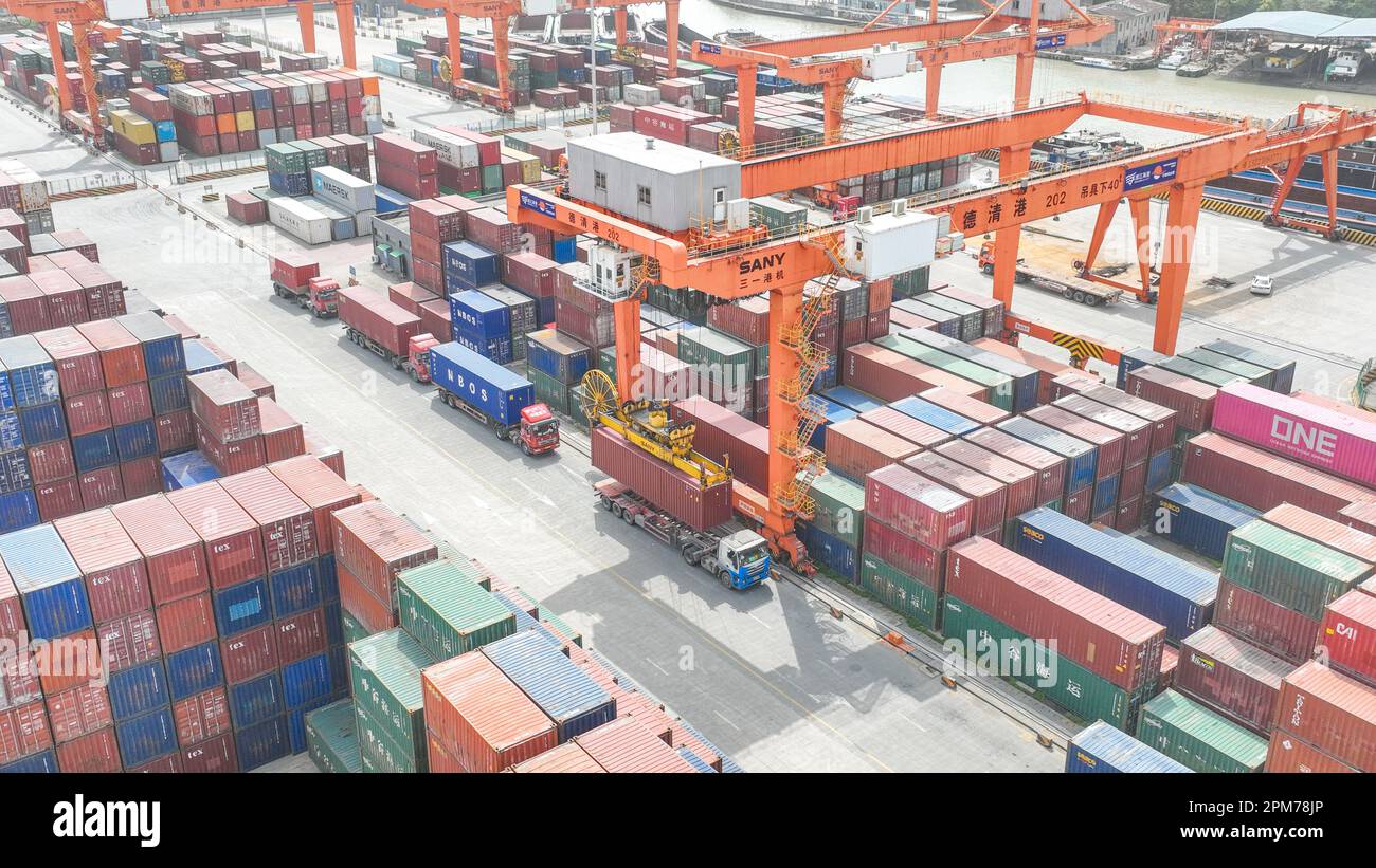 HUZHOU, CHINA - APRIL 12, 2023 - Aerial photo shows cargo ships loading ...