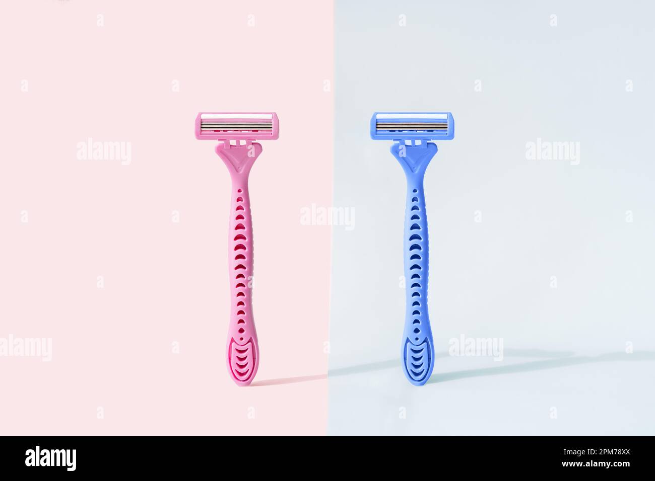 Razors with gender colors against pink and blue background Stock Photo ...