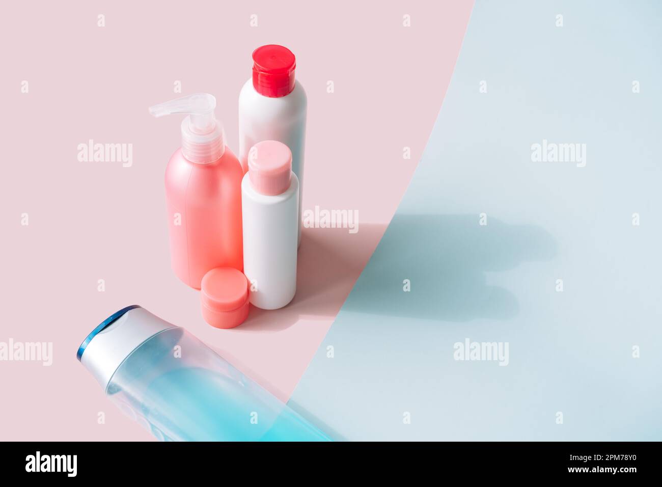Background is divided into pink and blue color with personal care ...