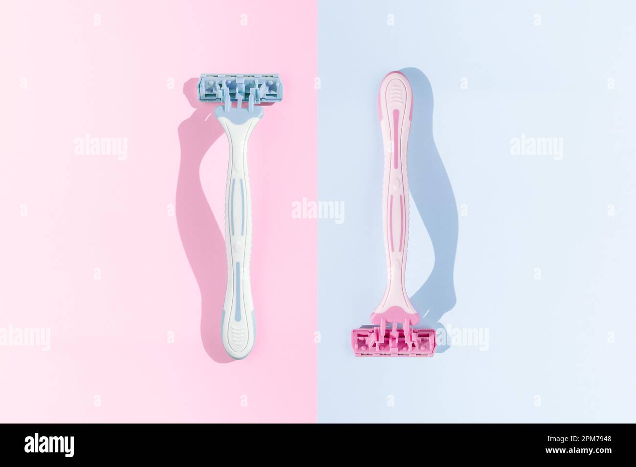 Blue and pink razor on pink and blue background Stock Photo - Alamy