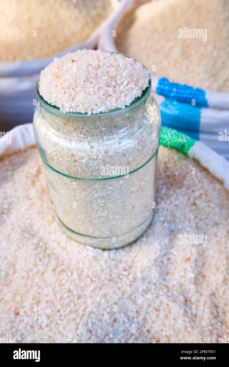 Bulk white rice for sale, measured with glass jars. At the main ...