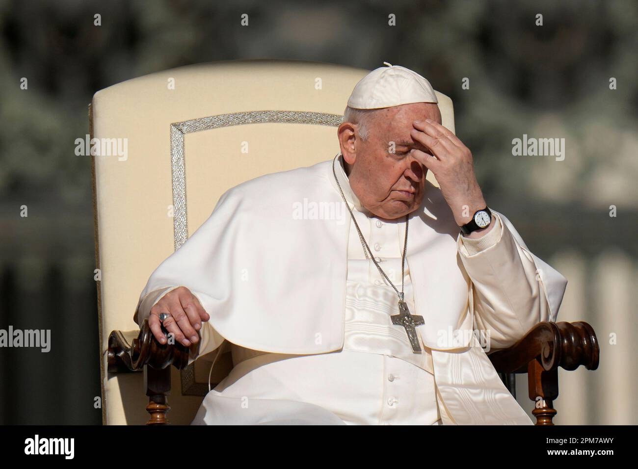 Pope Francis touches his forehead during his weekly general audience in ...