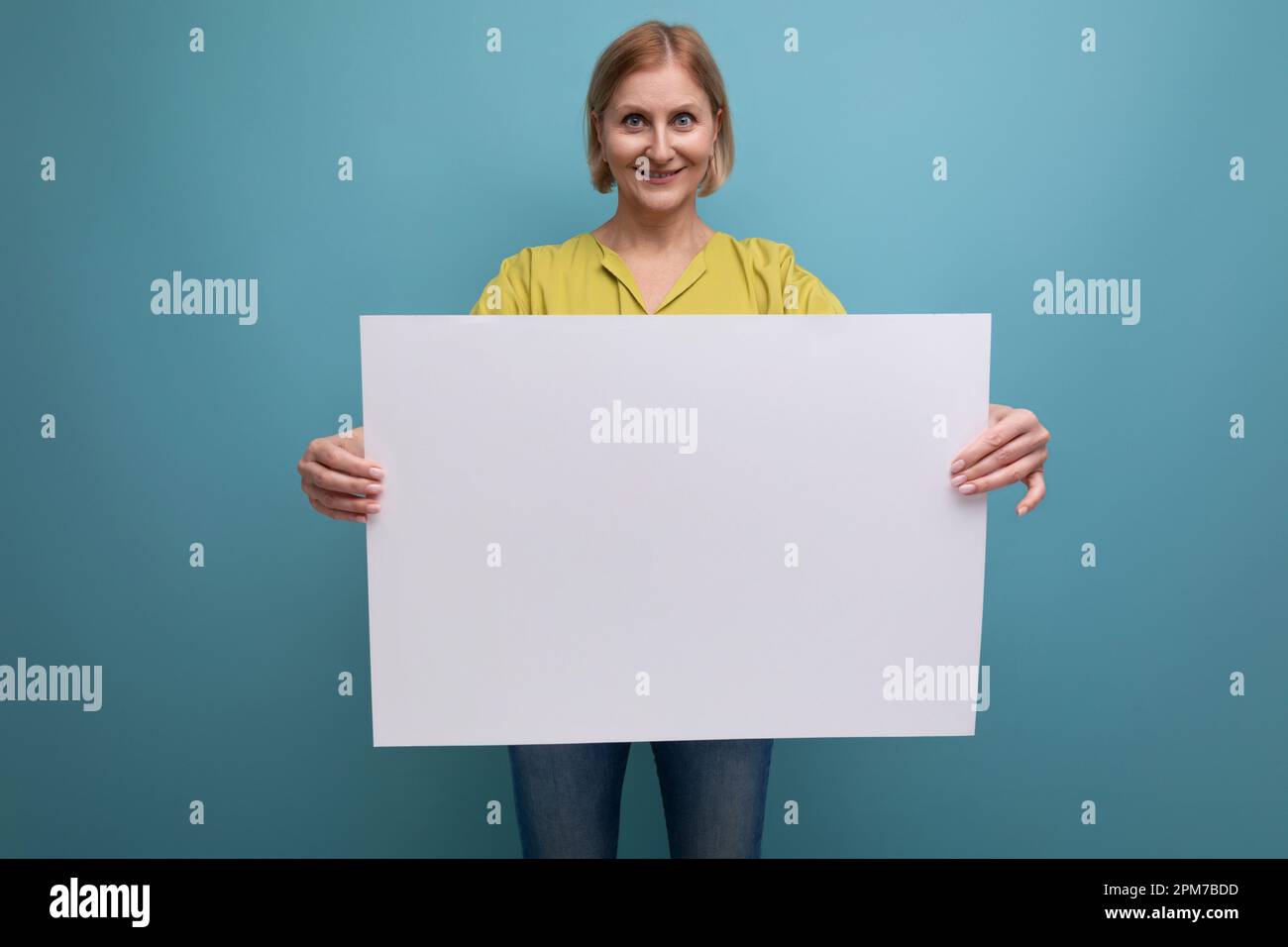 adult woman holding poster mockup for information Stock Photo - Alamy