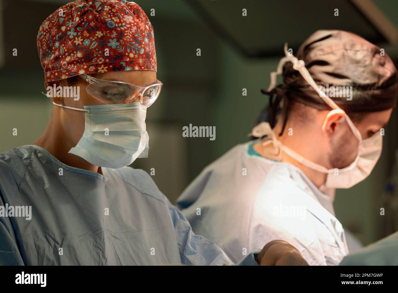 The faces of doctors surgeons in masks are a big plan, an operating ...