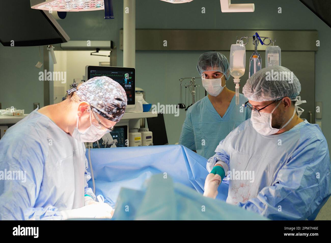 The faces of doctors surgeons in masks are a big plan, an operating ...