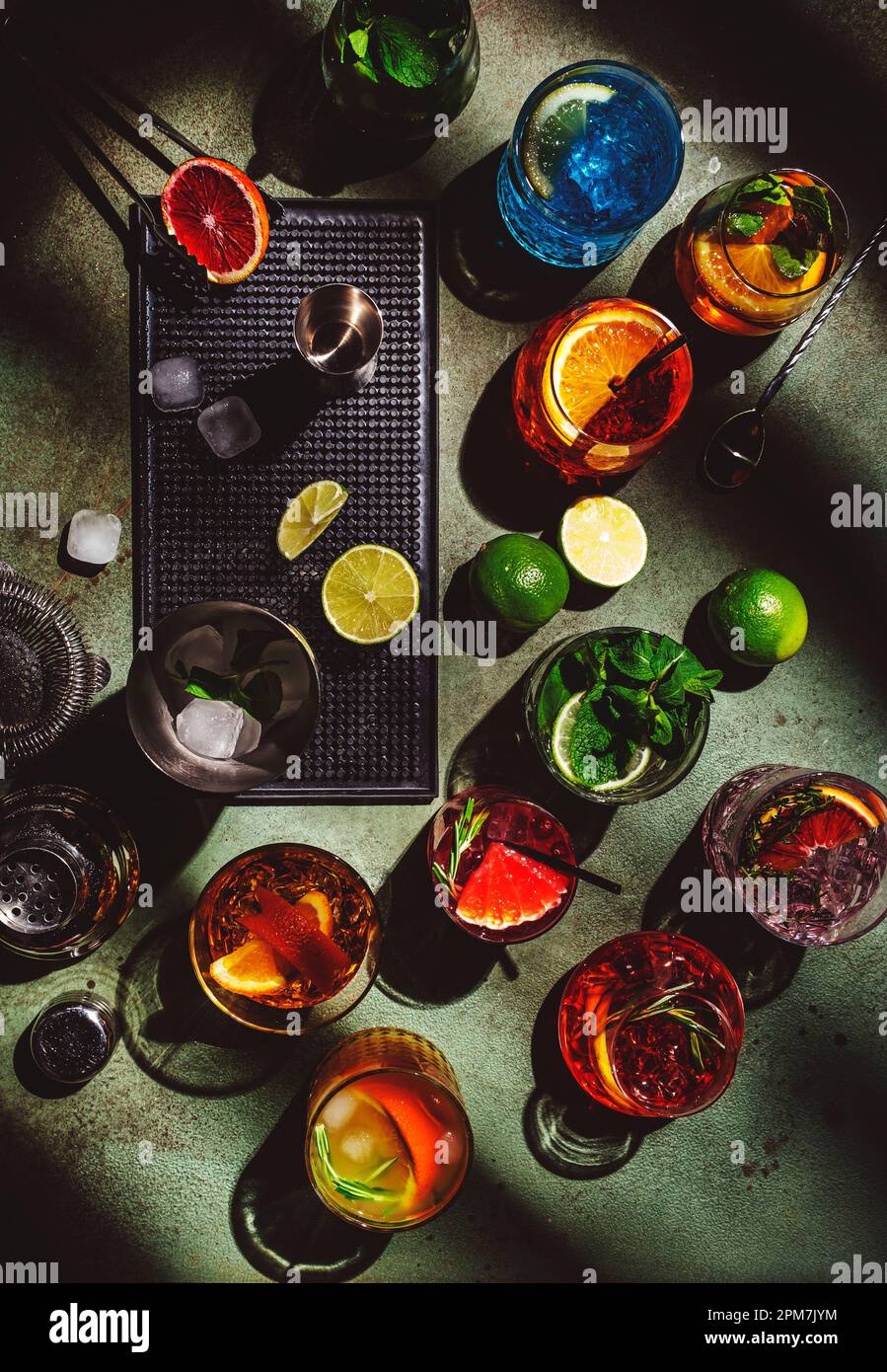 Cocktails set on rusty green bar counter, top view. Mixology concept ...