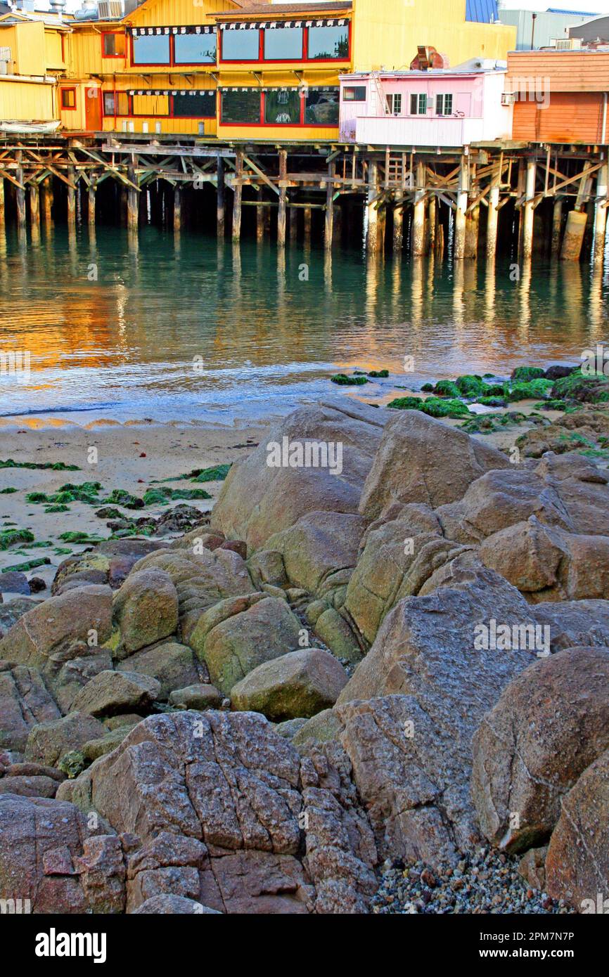 concrete pillars sustaining the old docks in Monterey Bay, California, USA. The basic rock piles ...