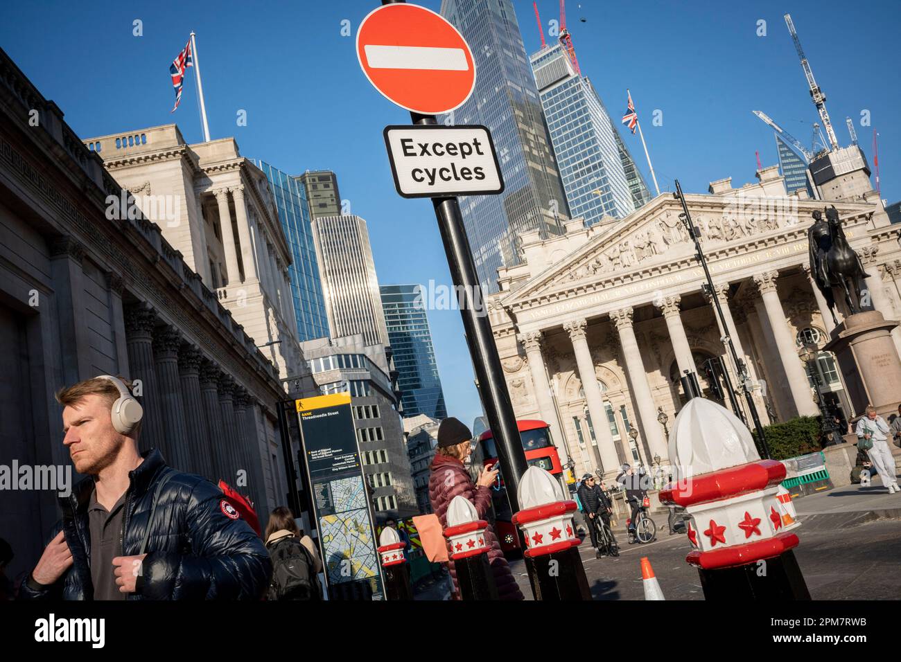 Pedestrians pass beneath a No Entry to vehicle traffic signpost at the ...