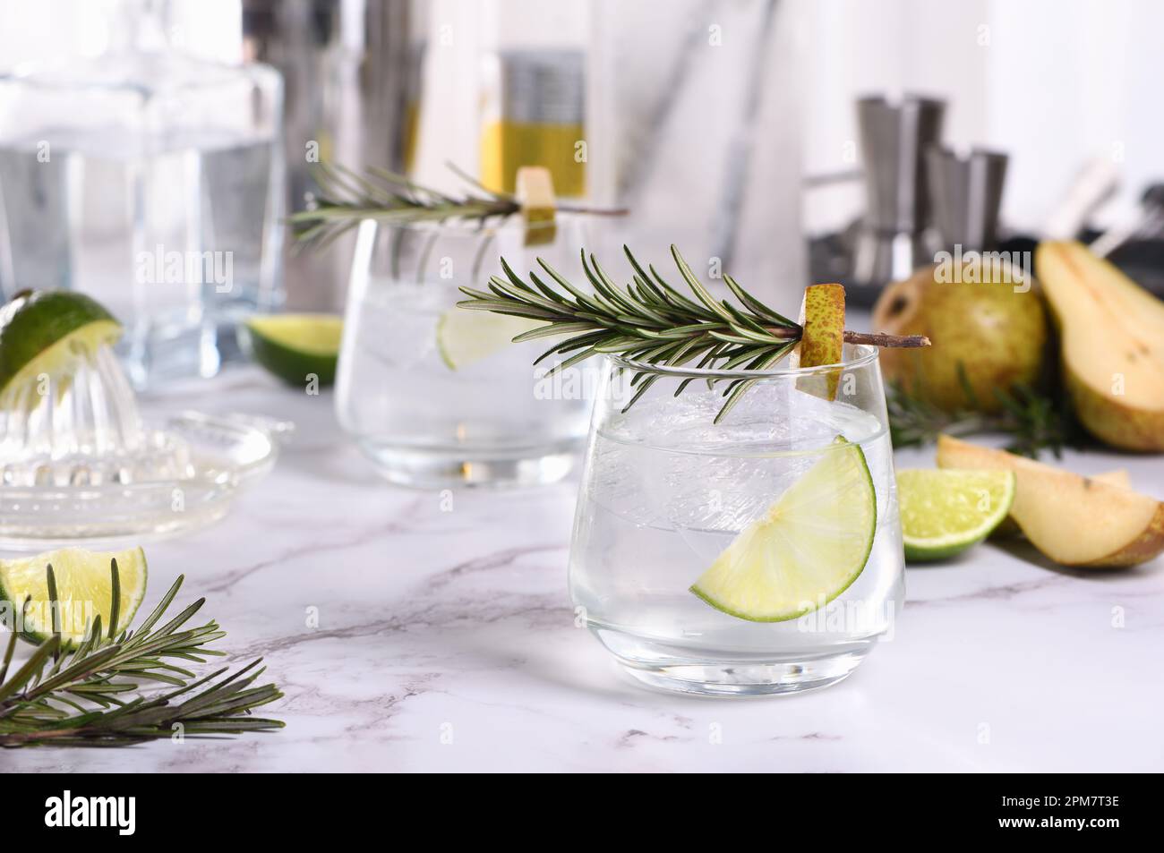 Gin Cocktail with lime, rosemary, ripe pear and tonic. This refreshing ...