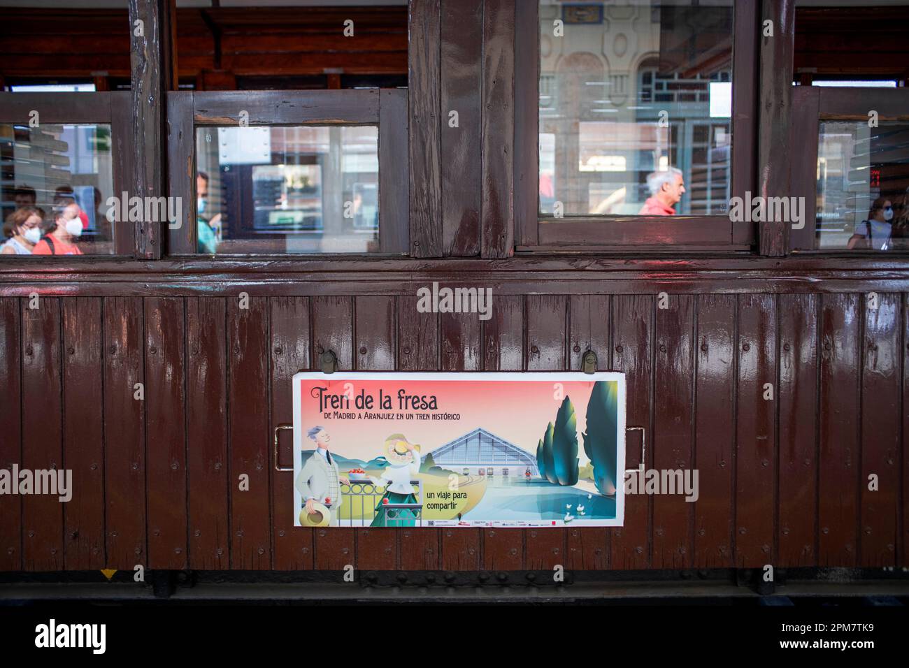 Strawberry train parked at Aranjuez train station, Madrid, Spain. Logo ...