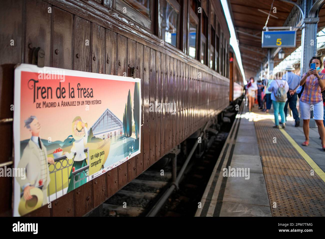 Strawberry train parked at Aranjuez train station, Madrid, Spain. Logo ...