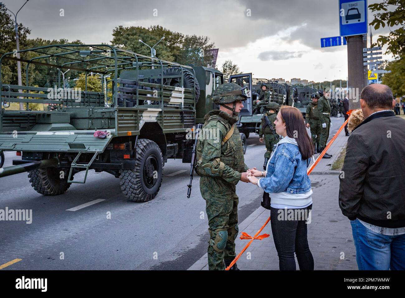 A soldier has a conversation with a woman during the preparations for ...