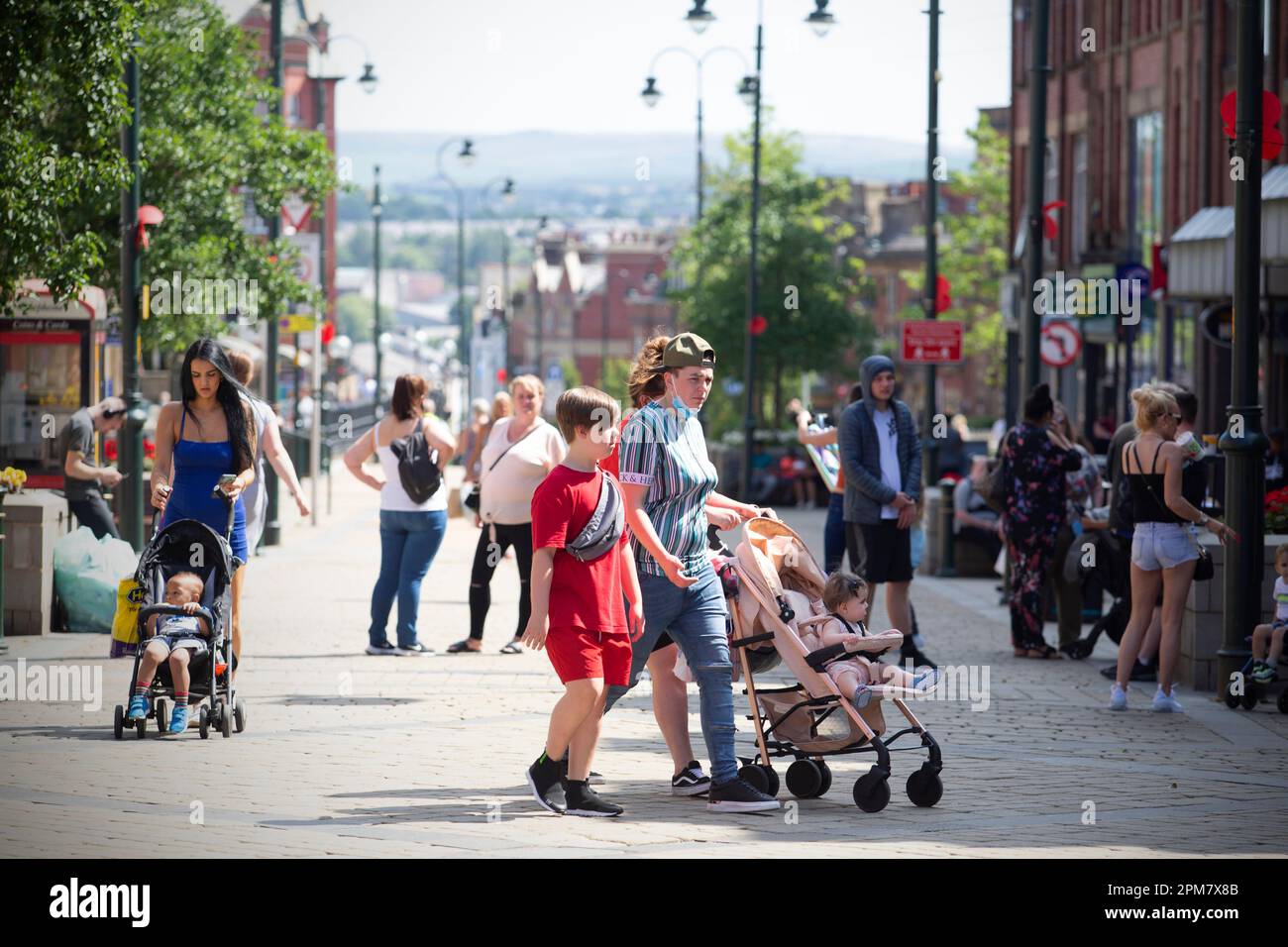 People walking around Oldham town centre in Greater Manchester. Oldham ...