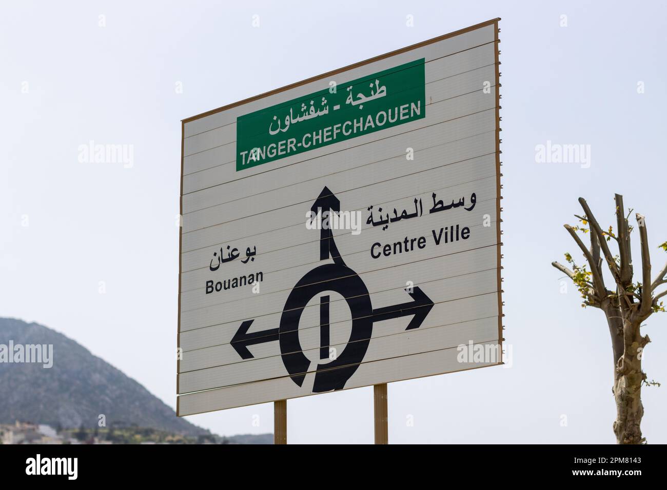 Big road sign in Morocco with three arrows indicating directions to ...
