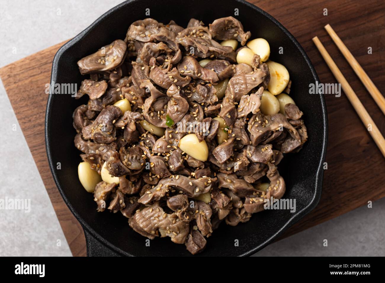 Stir-fried Spicy and Chewy Chicken Gizzard with Garlic Stock Photo - Alamy