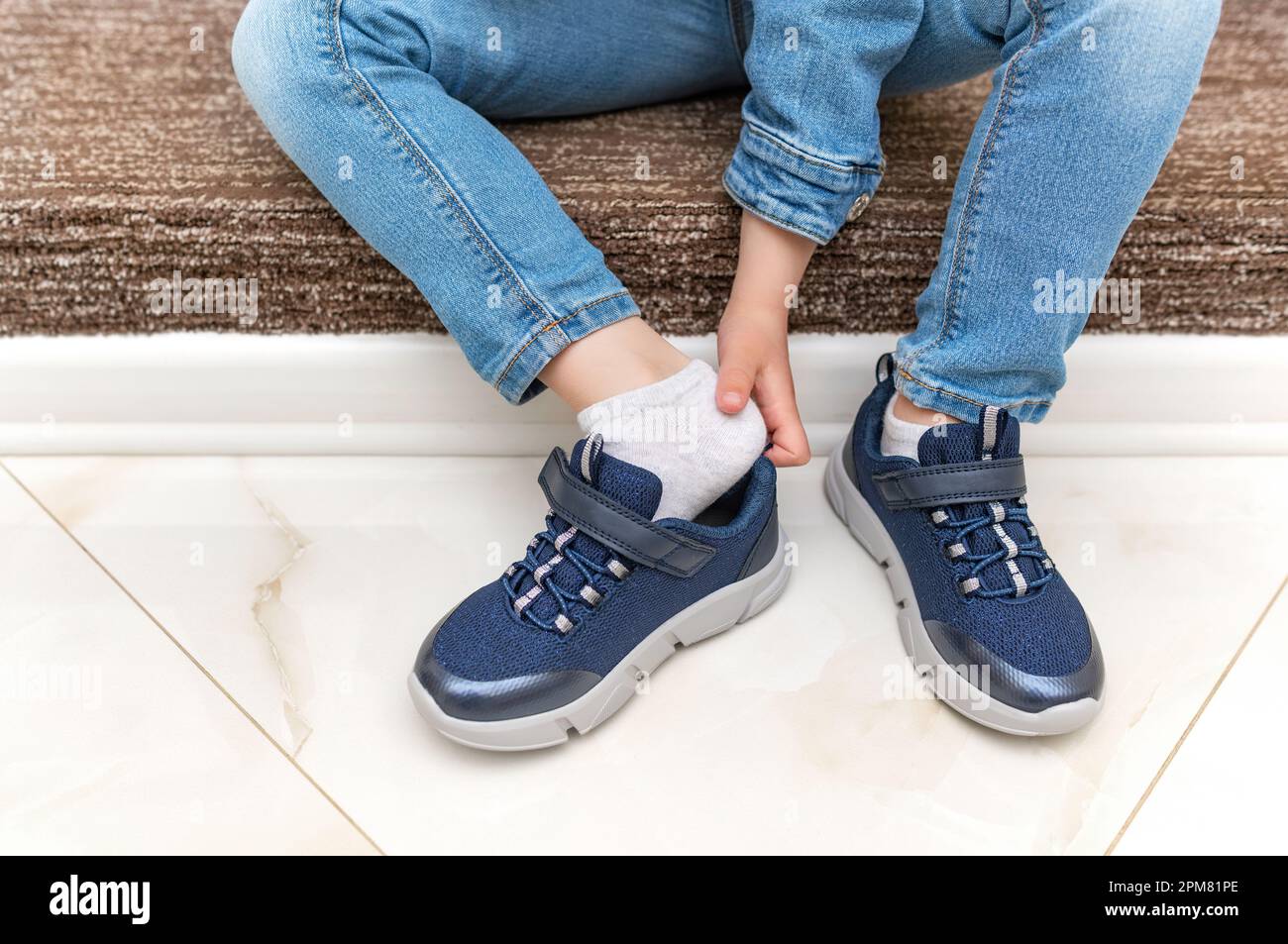 Kids Putting On Shoes