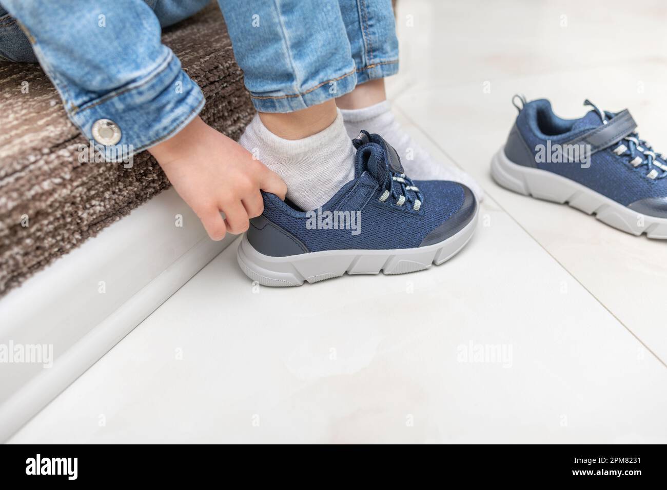 Kids Putting On Shoes