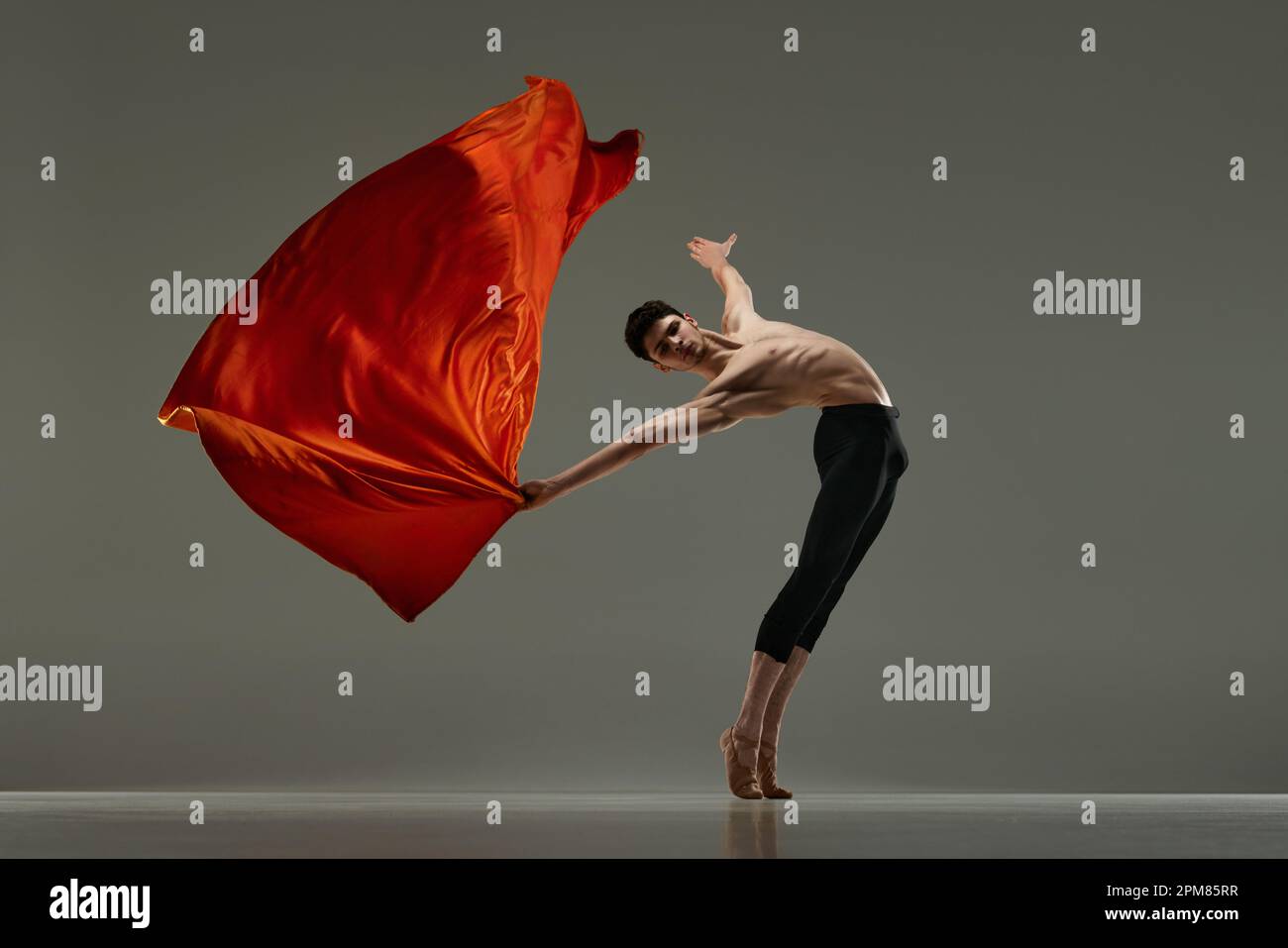 Graceful, handsome, young man, professional ballet dancer dancing with ...