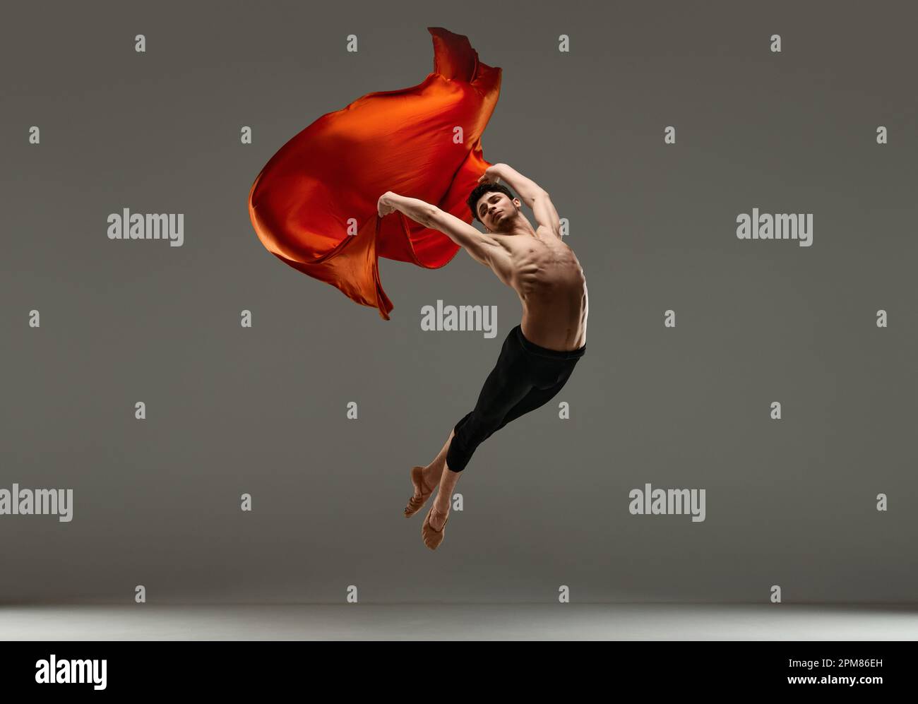 Young artistic man, ballet dancer with muscular body dancing, making ...