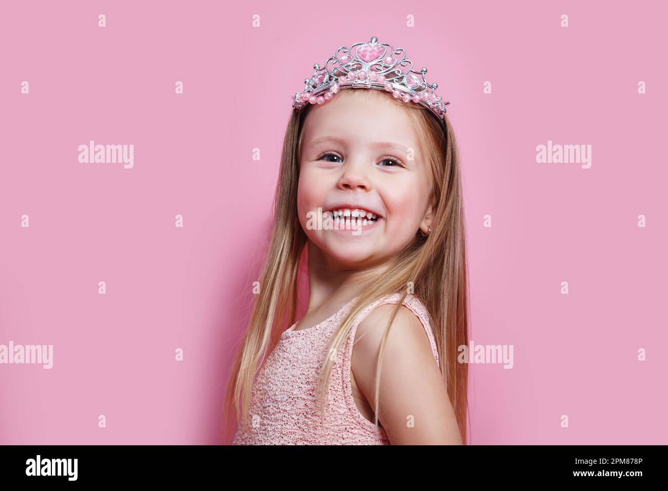 Close-up portrait of cute sweet little princess with toothy smile ...