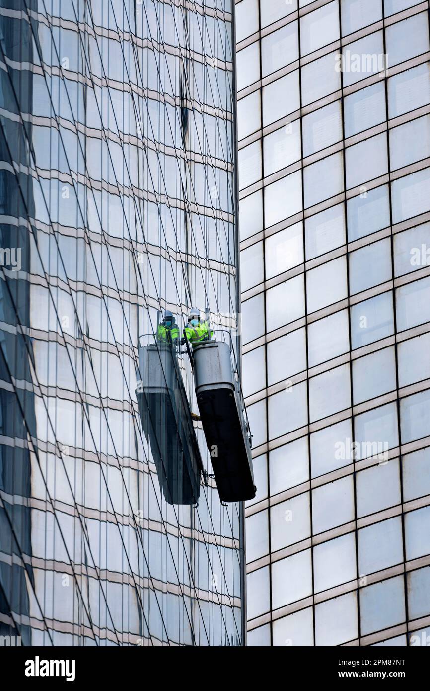 France, Hauts de Seine, Puteaux, La Défense district, window cleaner on ...