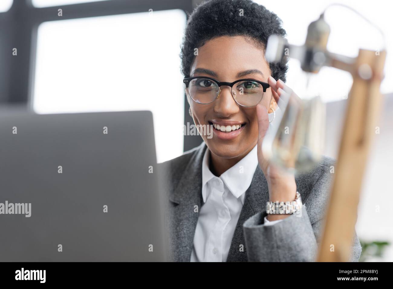 African american businesswoman adjusting hi-res stock photography and images - Alamy