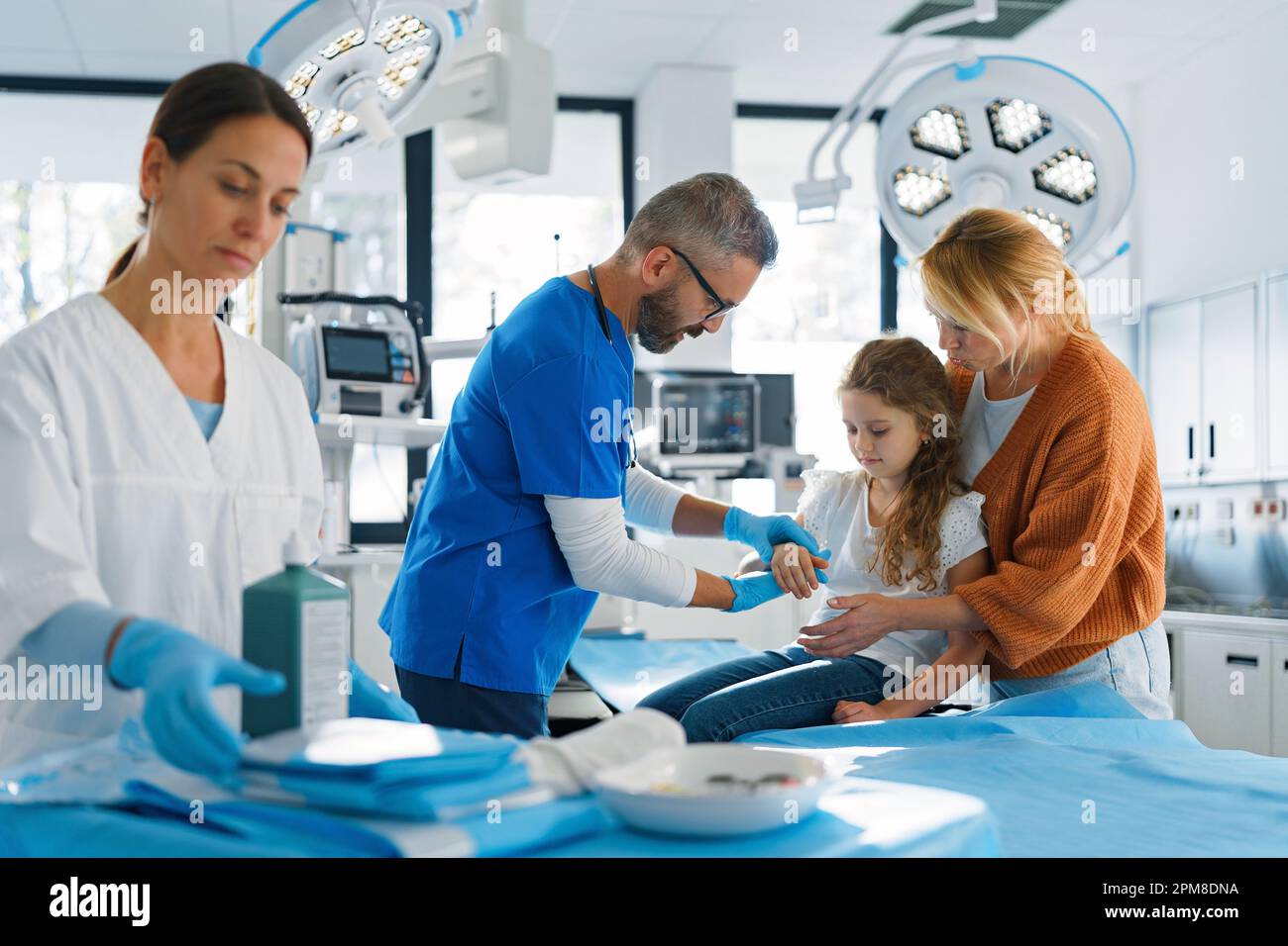 Little girl with her mother in surgery examination Stock Photo - Alamy