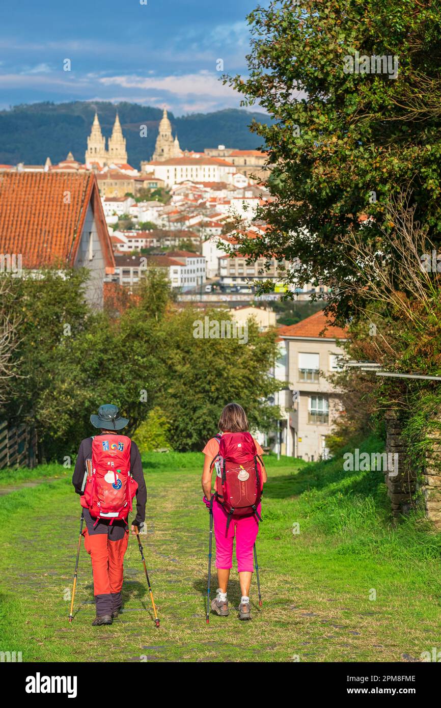 Spain, Galicia, arrival of two pilgrims in Santiago de Compostela after ...