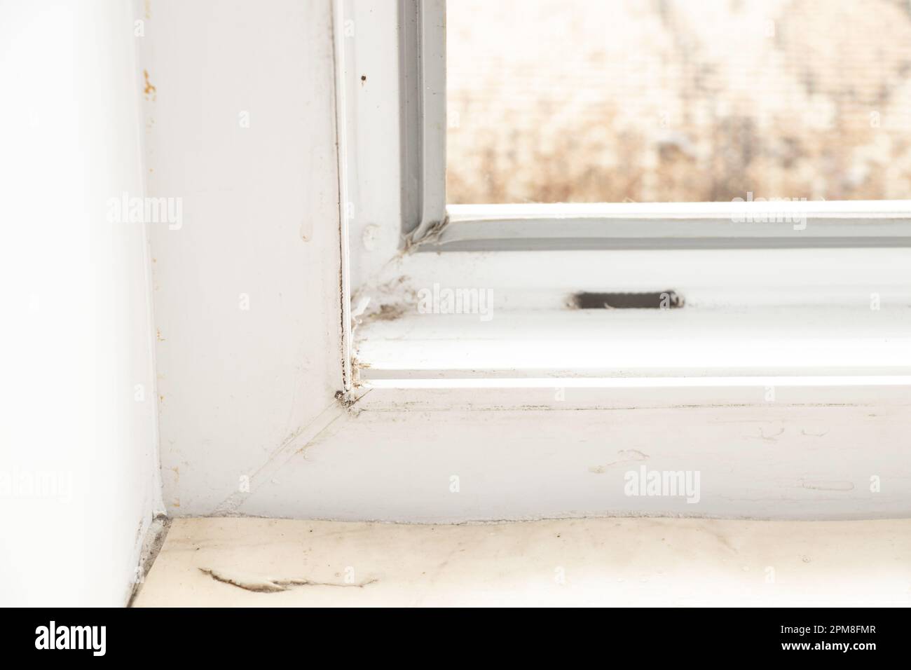Dirty window close-up in the apartment, metal-plastic window frame ...