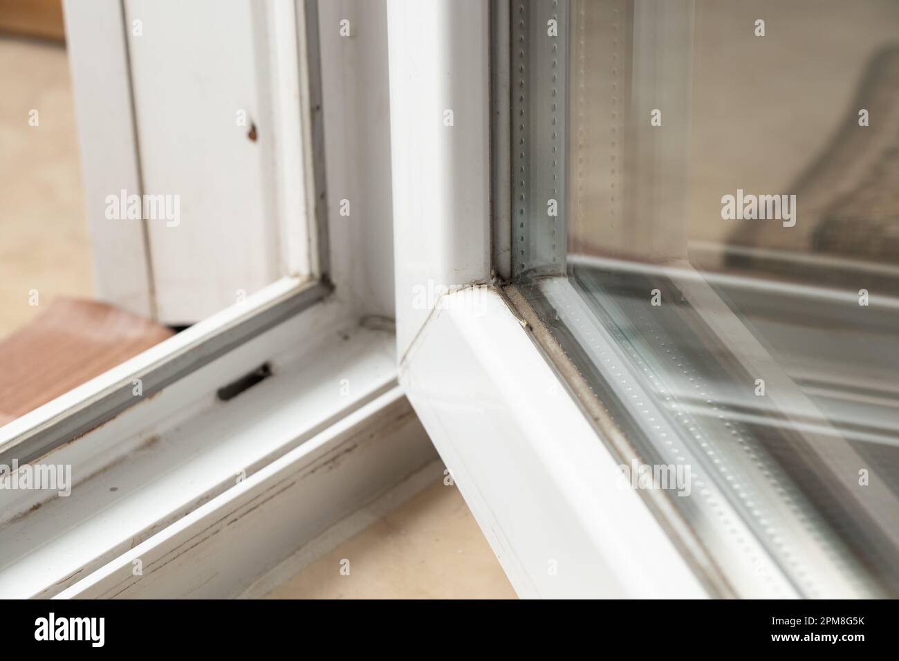 Dirty window close-up in the apartment, metal-plastic window frame ...