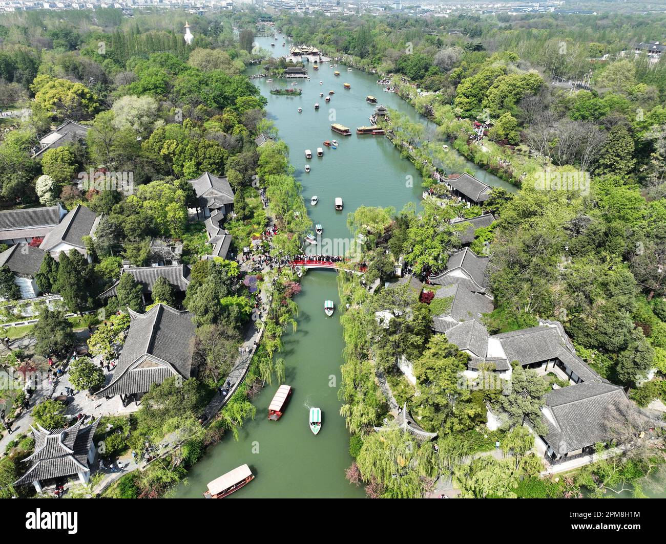 Aerial photo shows tourists visiting the Slender West Lake scenic area ...