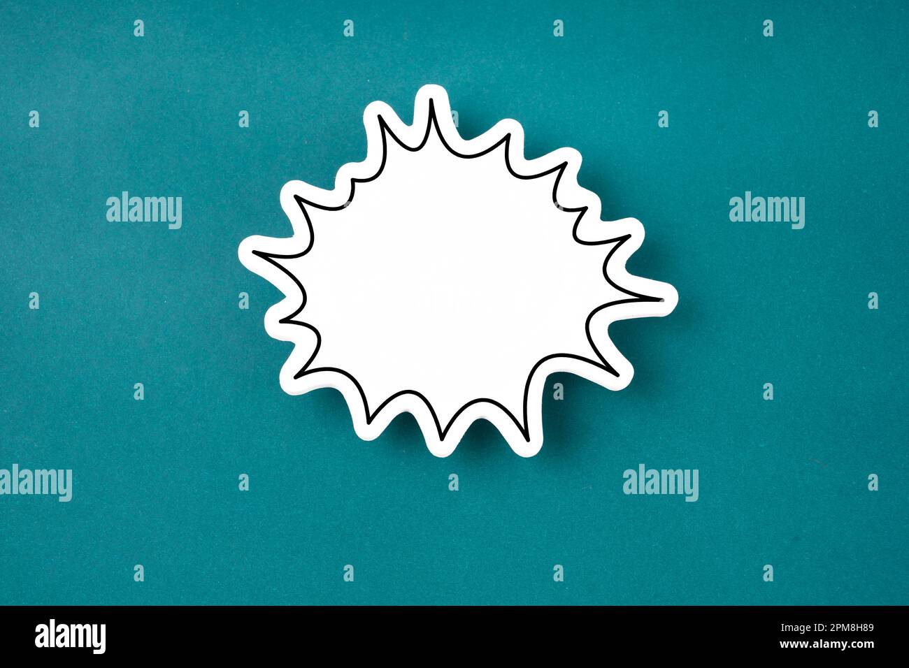 White speech bubble shaped post it note on green background with copy ...