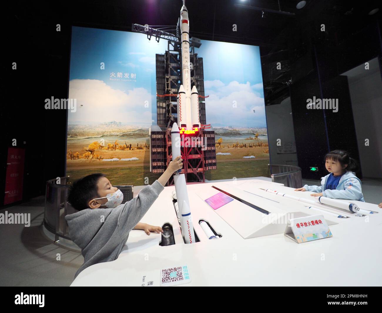 BEIJING, CHINA - APRIL 12, 2023 - A child experiences a rocket launch ...