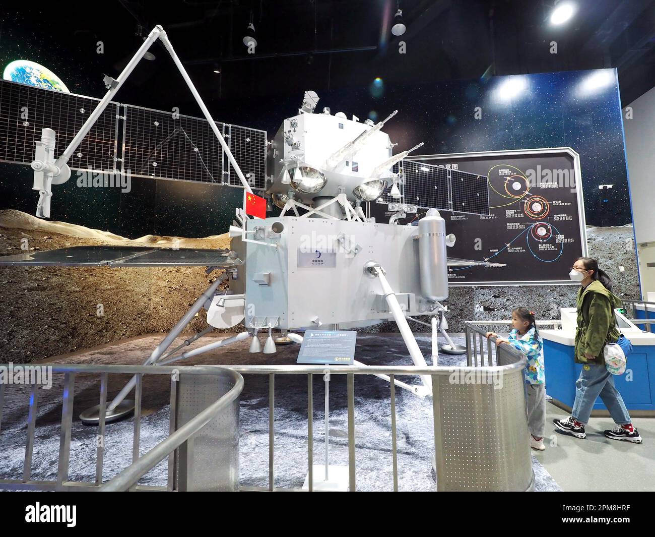 BEIJING, CHINA - APRIL 12, 2023 - Children look at a model of the Chang ...