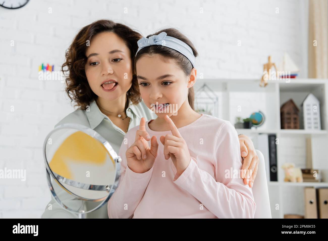 Woman sticking tongue out in mirror hi-res stock photography and images ...